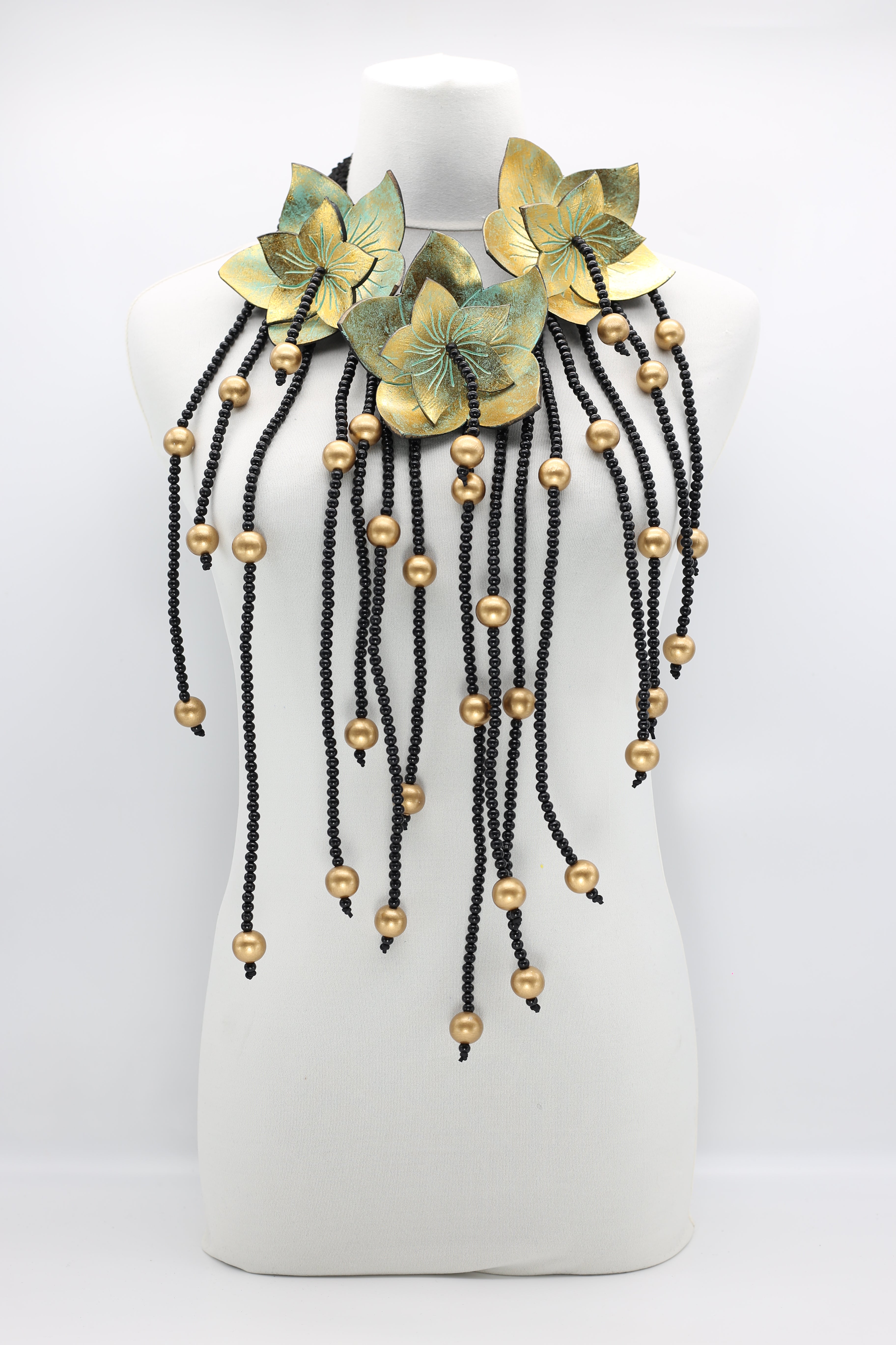 Turquoise and gold coconut shell water lily with black and gold beads ...